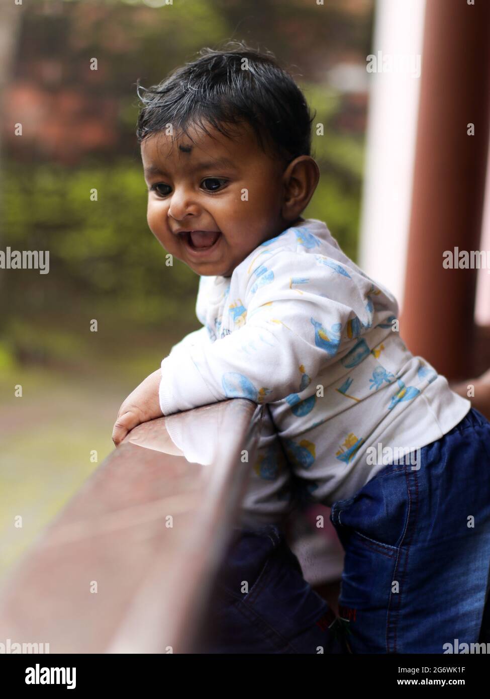 portrait of a happy, cute child curiously looking at something Stock ...