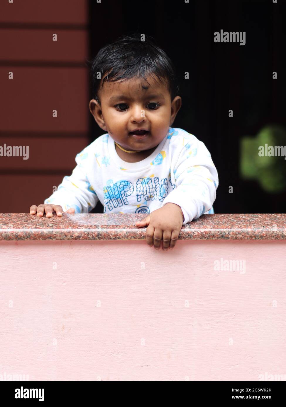 portrait of a happy, cute child curiously looking at something Stock ...