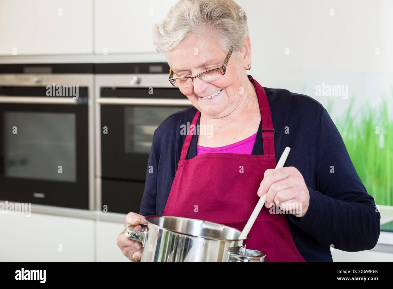 Grandma cooking comfort food in her kitchen Stock Photo - Alamy