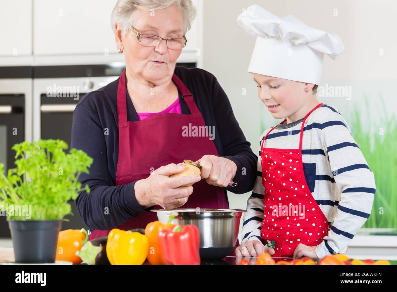 Happy grandma and grandson cooking together Stock Photo - Alamy