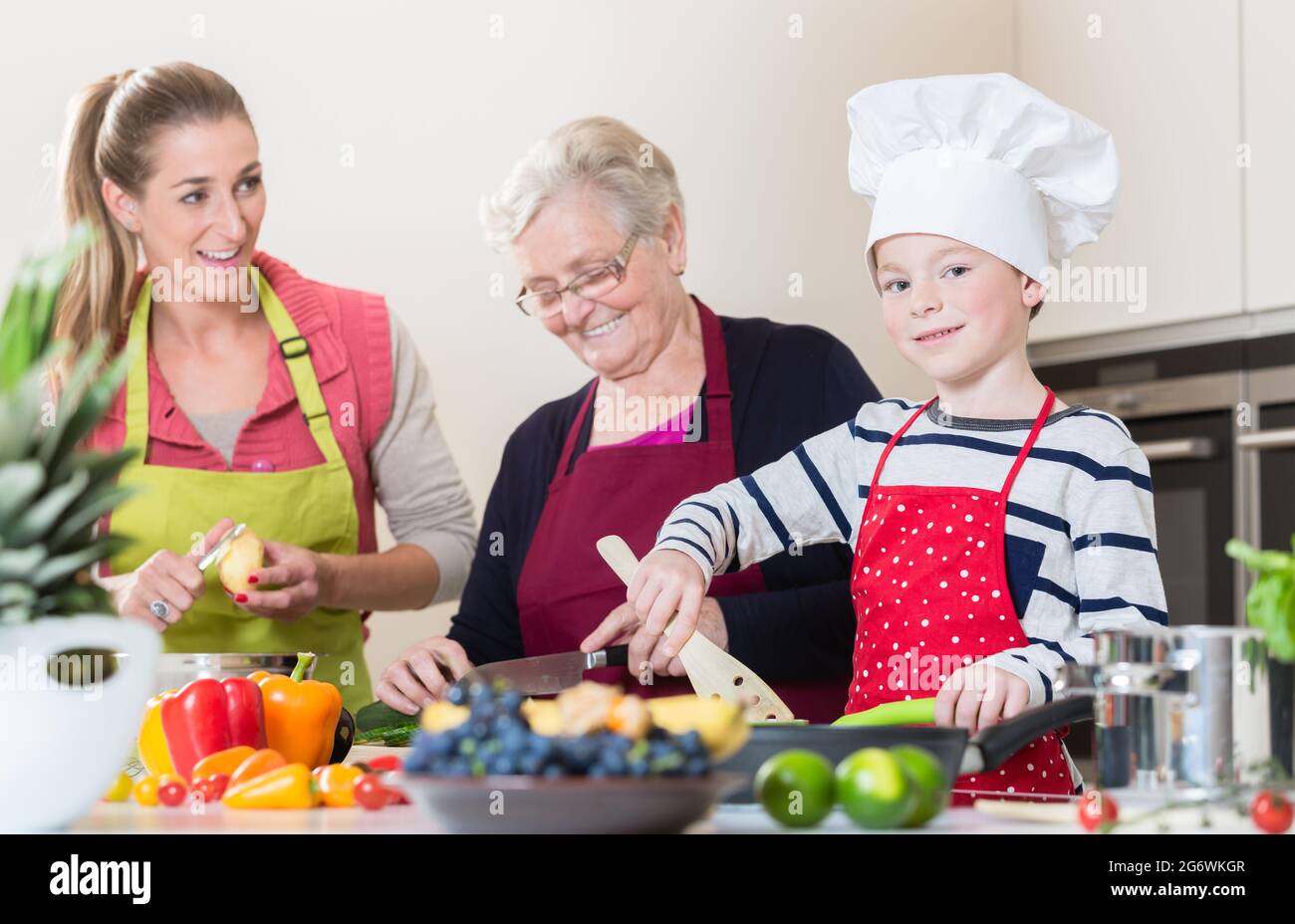 Family in kitchen talking mom and son hi-res stock photography and ...