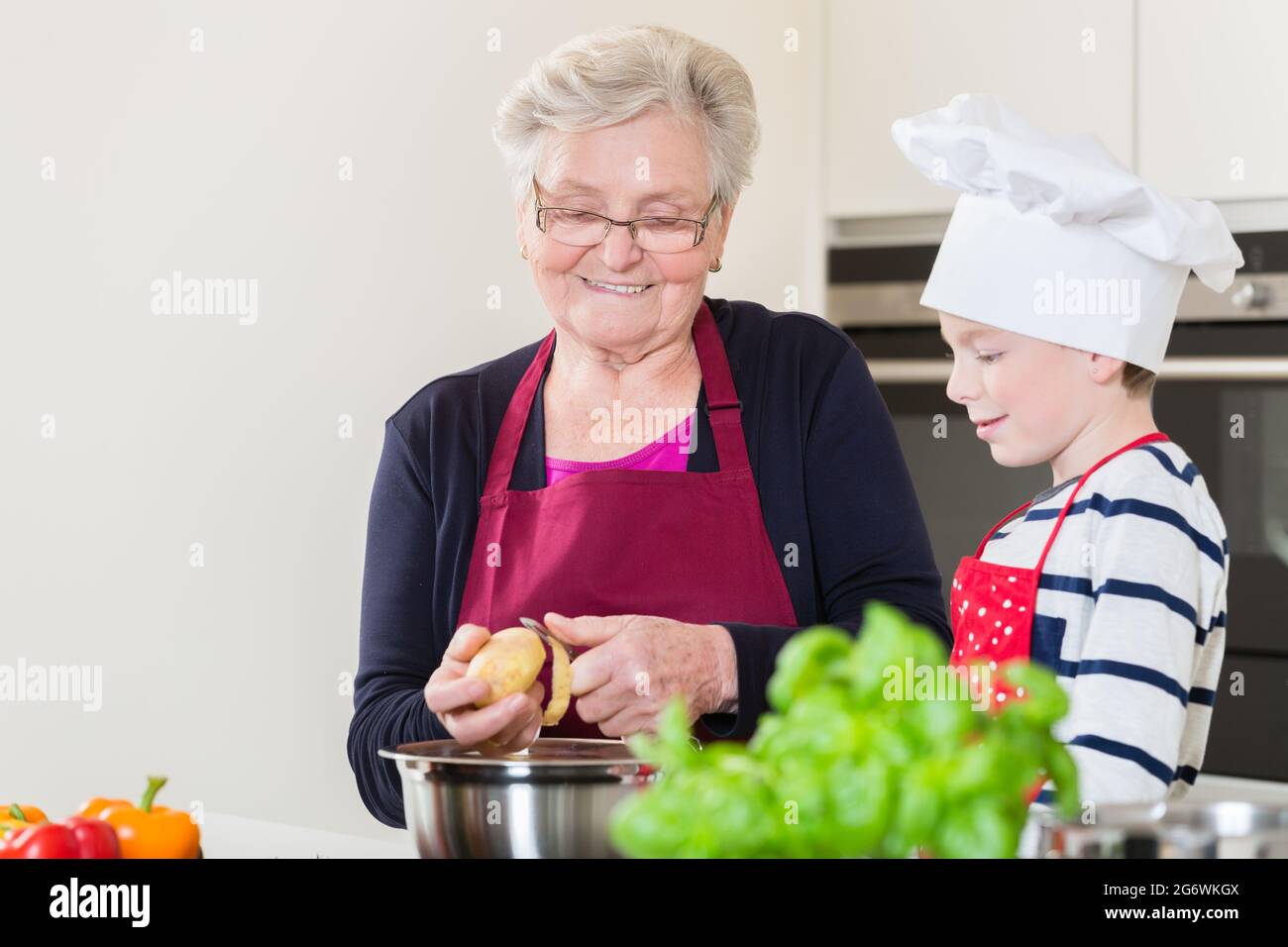 Happy grandma and grandson cooking together Stock Photo - Alamy