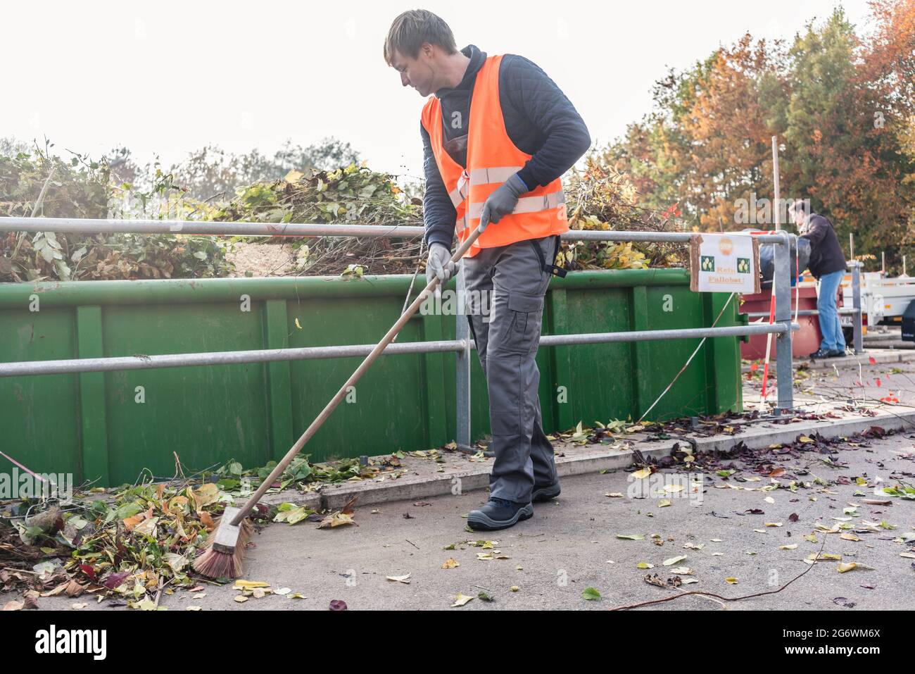 Worker sweeping floor in hi-res stock photography and images - Alamy