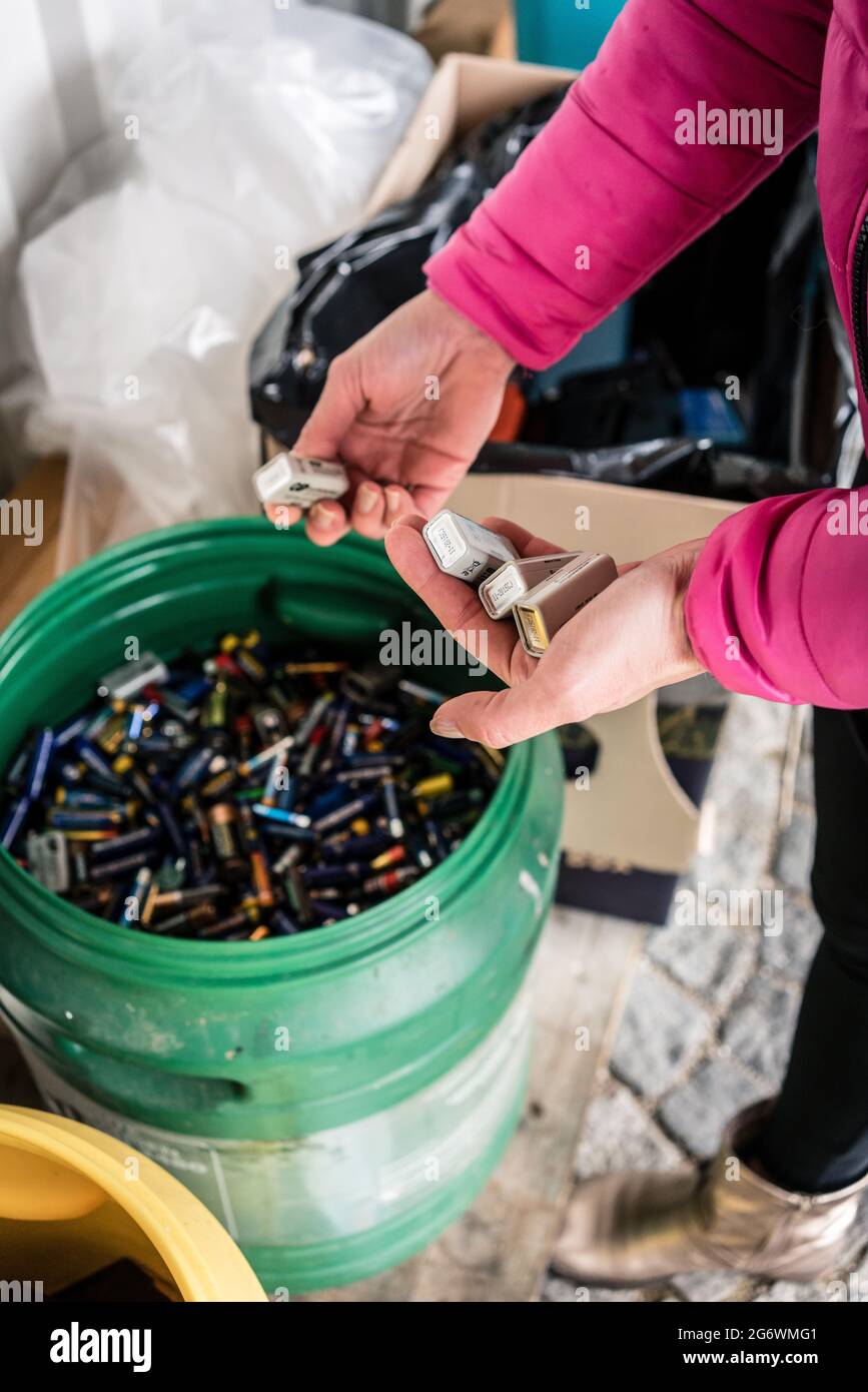 Hands collect batteries hi-res stock photography and images - Alamy