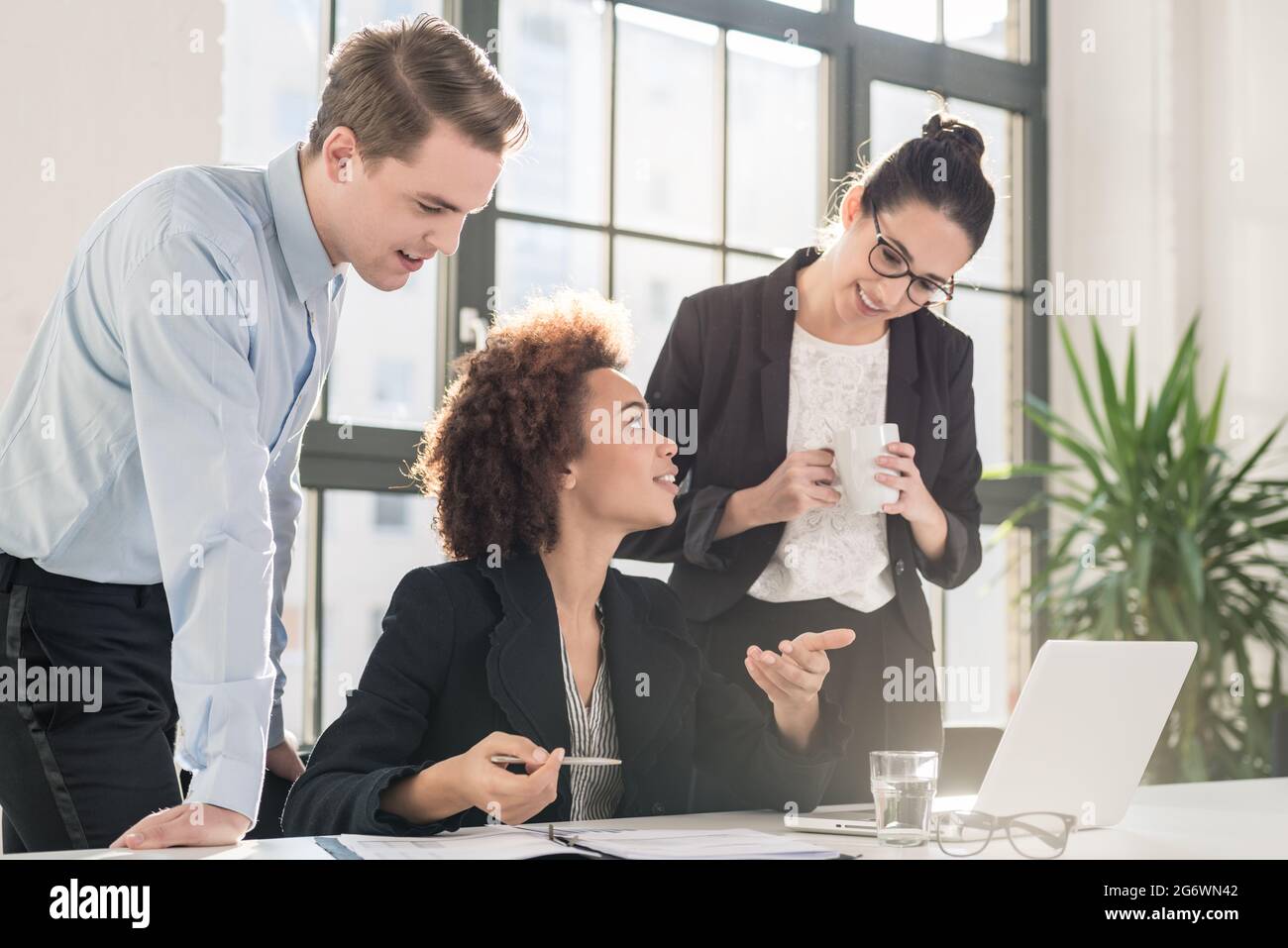 Black male colleagues helping hi-res stock photography and images - Alamy