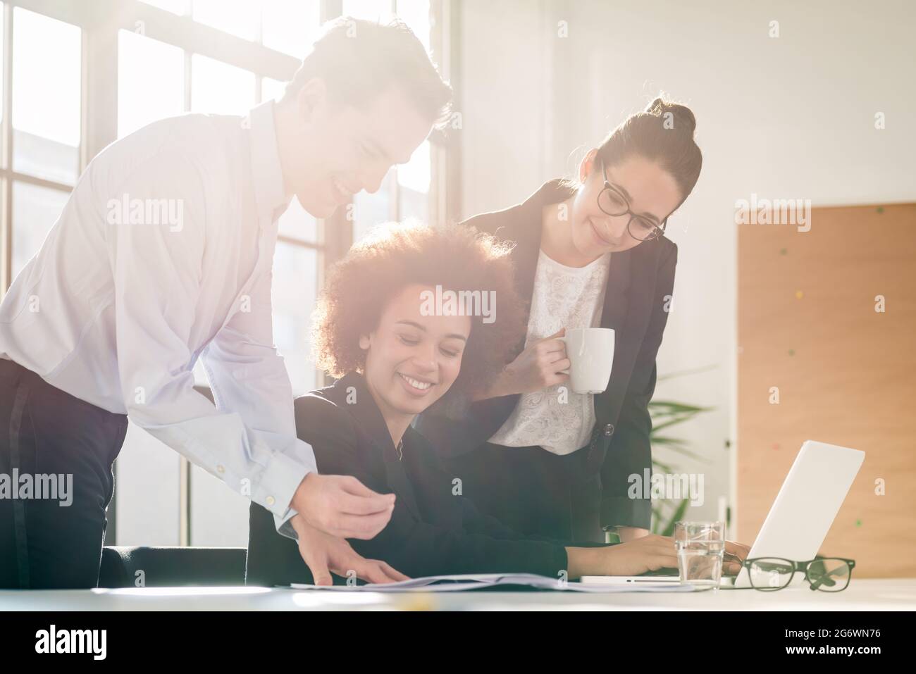 Young female employee asking for advice her helpful experienced ...