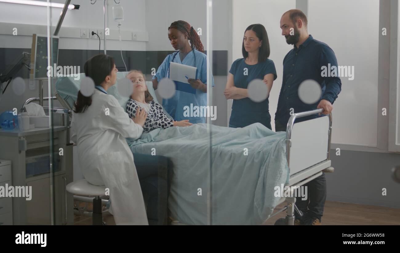 Pediatric doctor examining breathing sickness symptoms while african ...