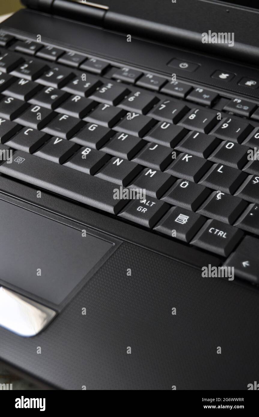 A black color laptop and Q keyboard detail, close-up black laptop ...