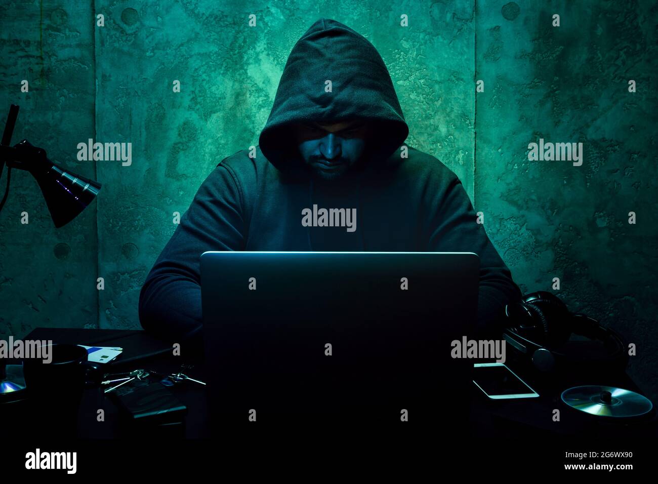Hacker programmer using computer in dark room Stock Photo - Alamy