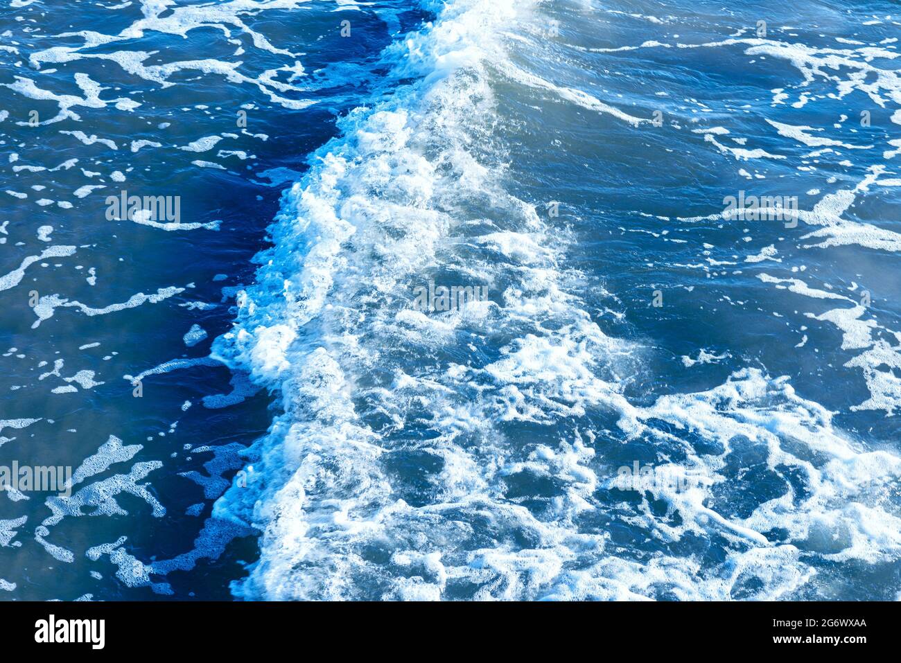 Areal shot of deep blue and rough sea with lot of sea spray.Blue ...