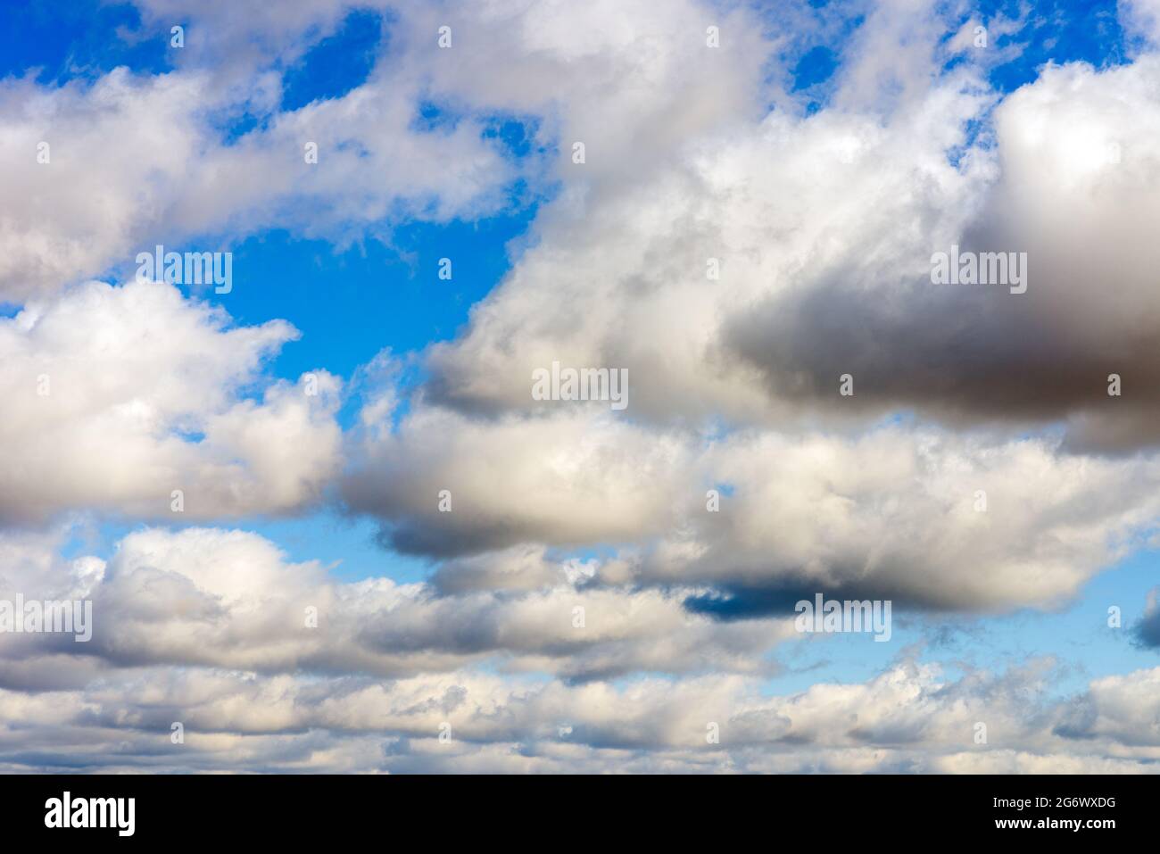 white fluffy clouds in the blue sky background.Blue cloudy white sky in ...