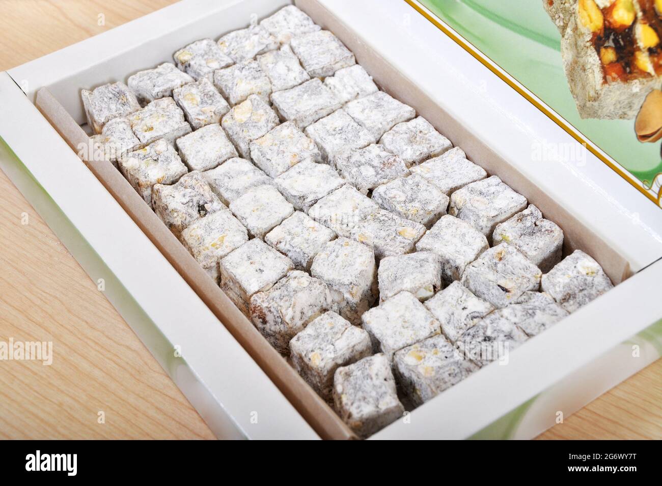 Turkish delight with pistachio and powdered sugar, carefully packed ...