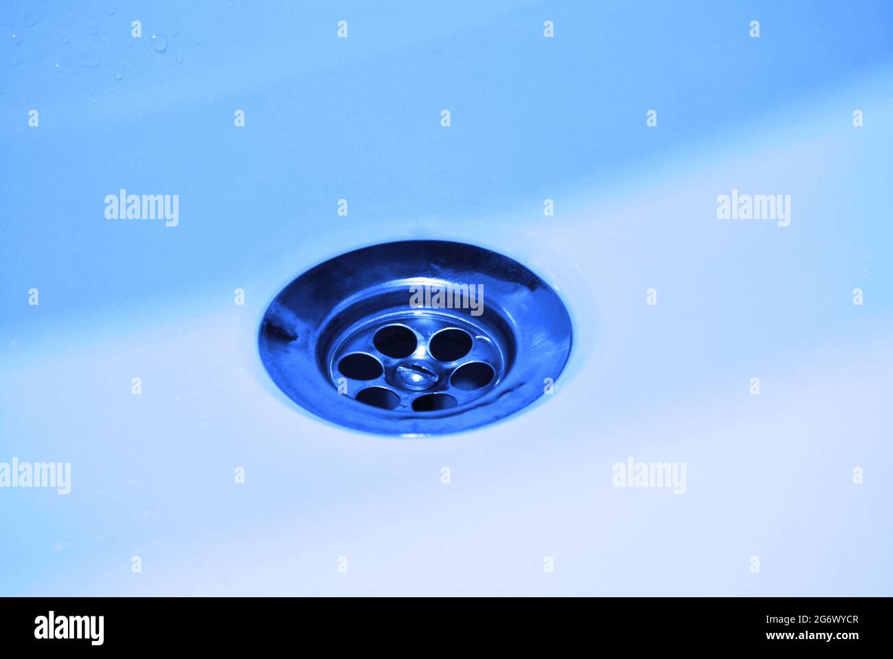 Drain in a white clean sink, background, close-up Stock Photo - Alamy