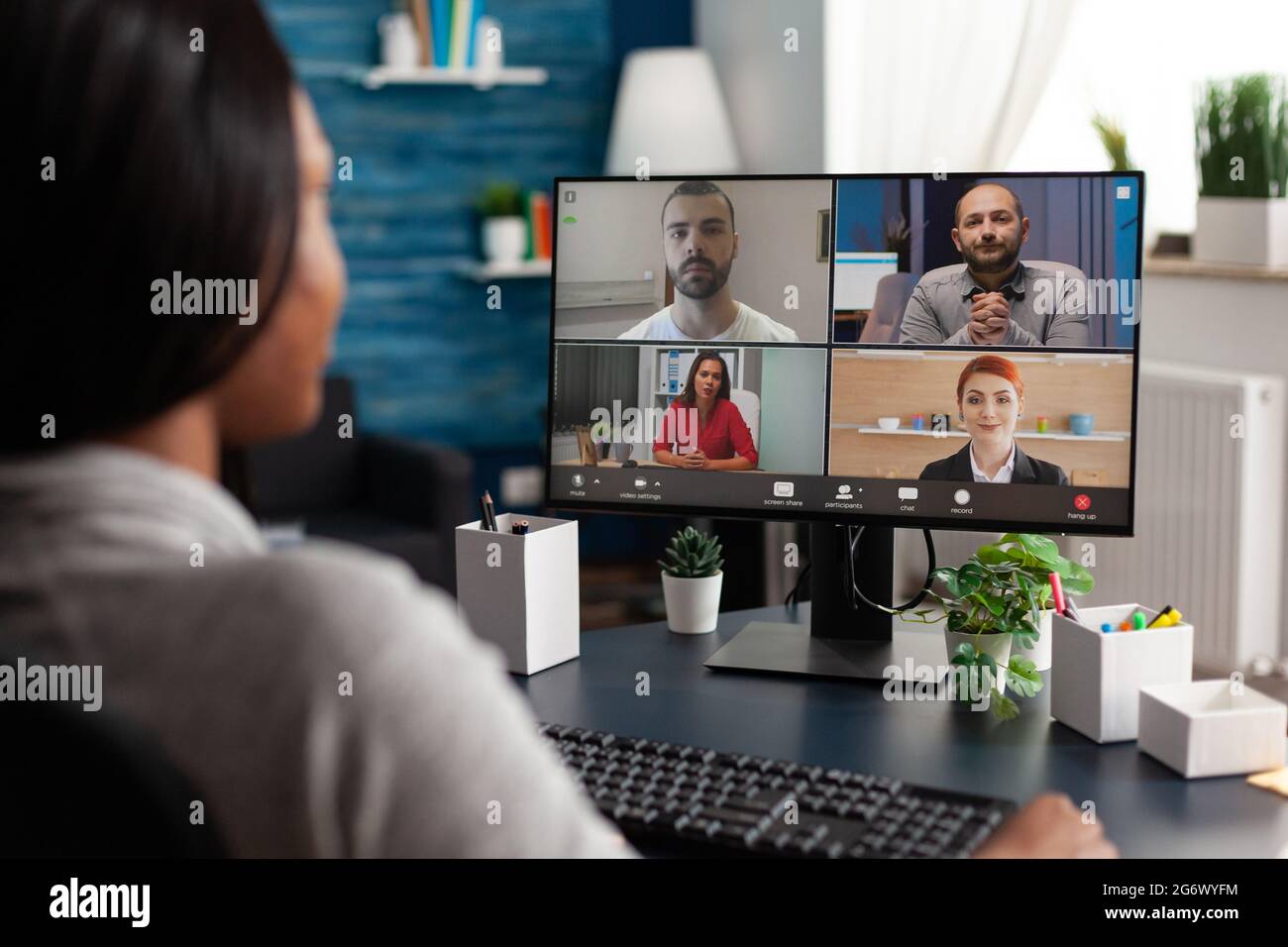 Black woman discussing school project deadline with remote collegue ...