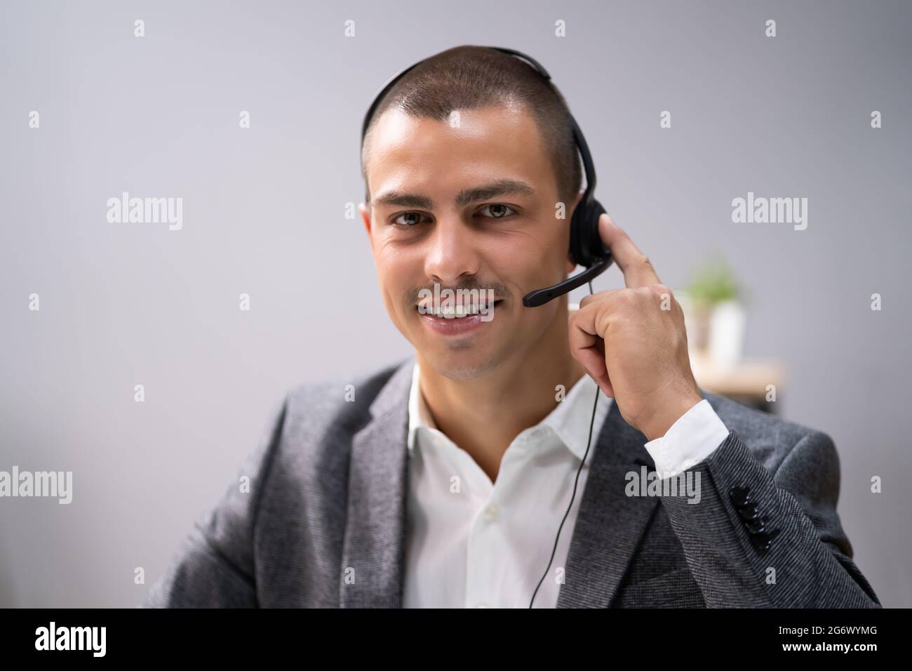 Customer Service Agent Man In Call Center Stock Photo - Alamy