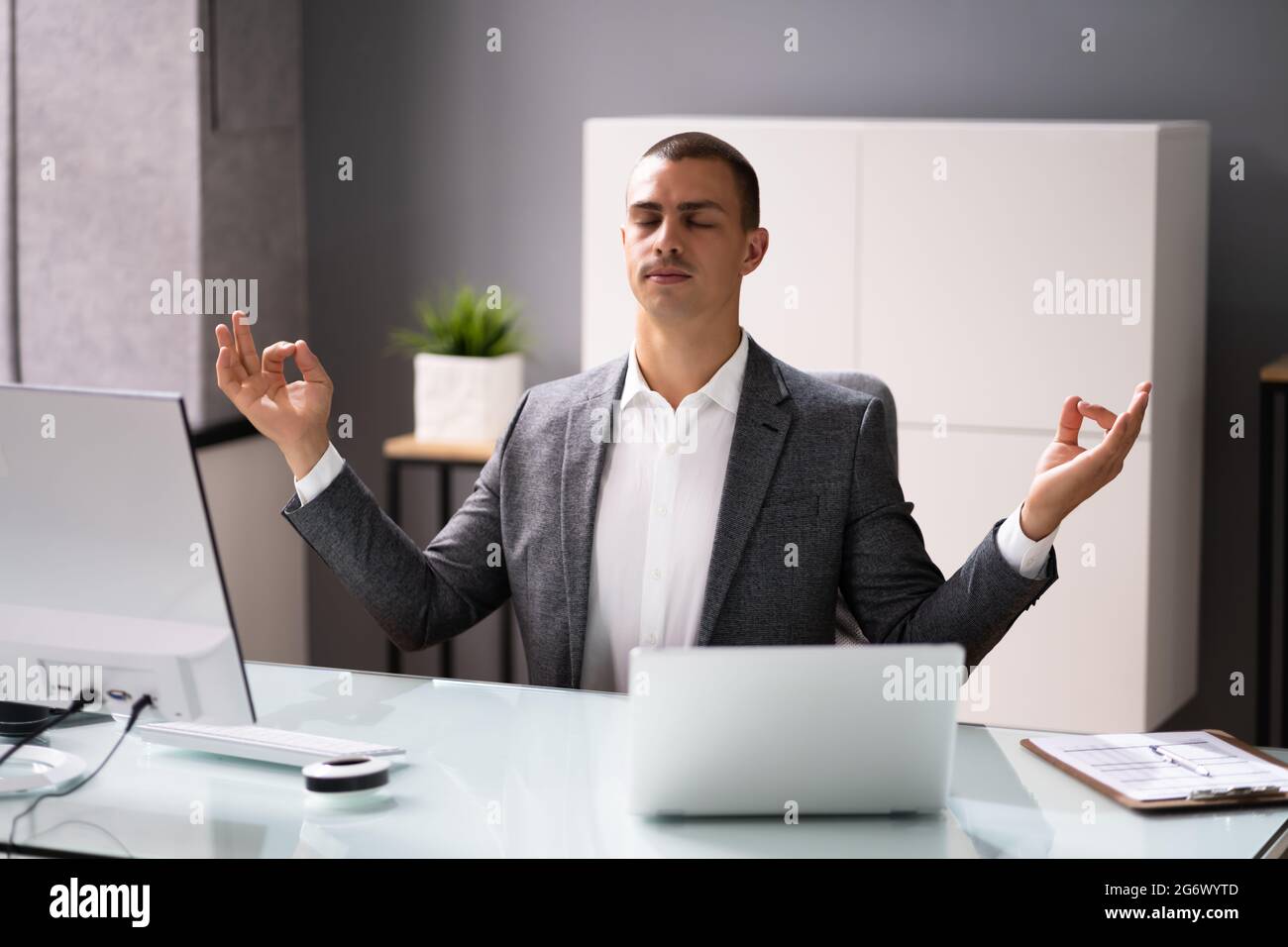 Yoga Meditation Exercise In Office. Male Business Man Meditating Stock ...