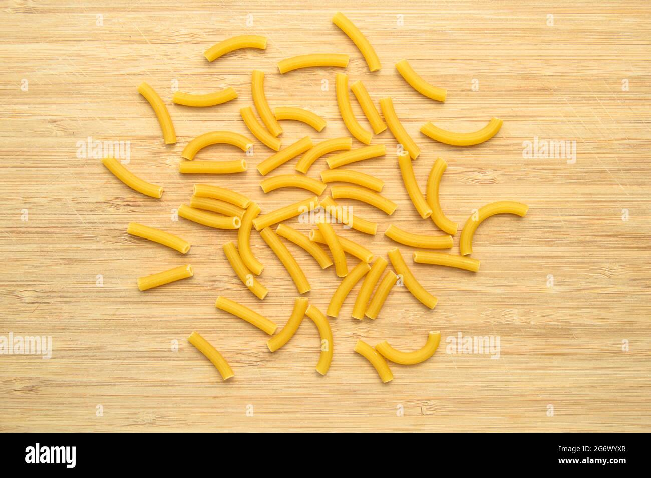 Raw fresh and healthy dry macaroni pasta foot background Stock Photo ...