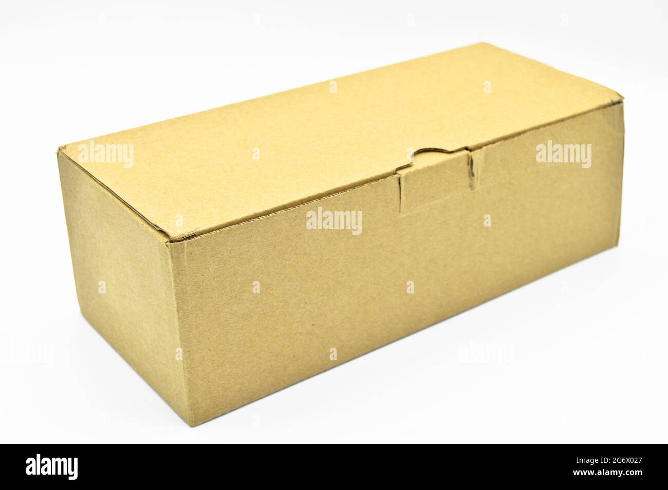 Closed beige rectangular cardboard box with corrugated cardboard lid ...