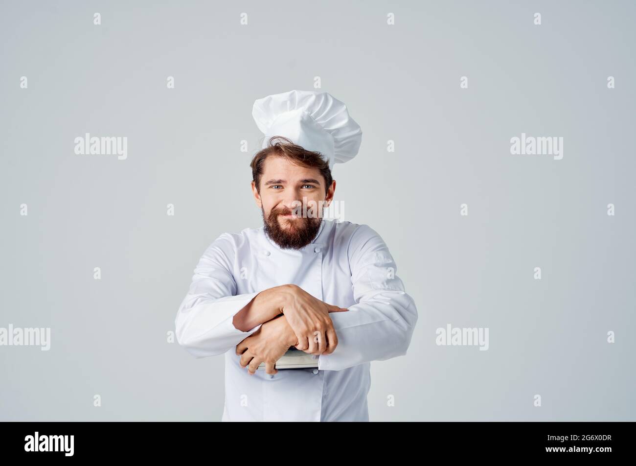 bearded male chef with a saucepan in his hands kitchen restaurant work ...