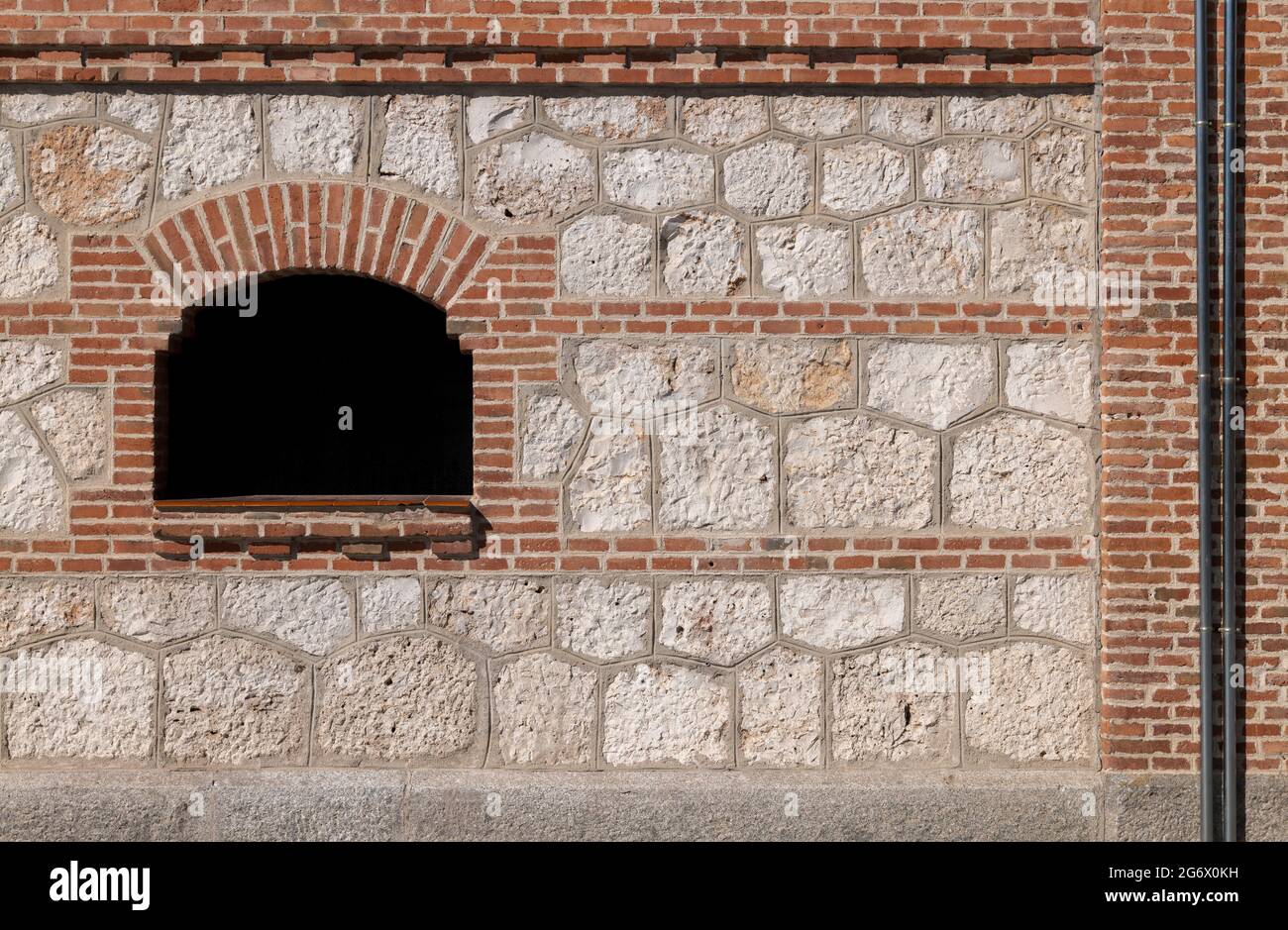 Detail of a brick wall with window Stock Photo - Alamy