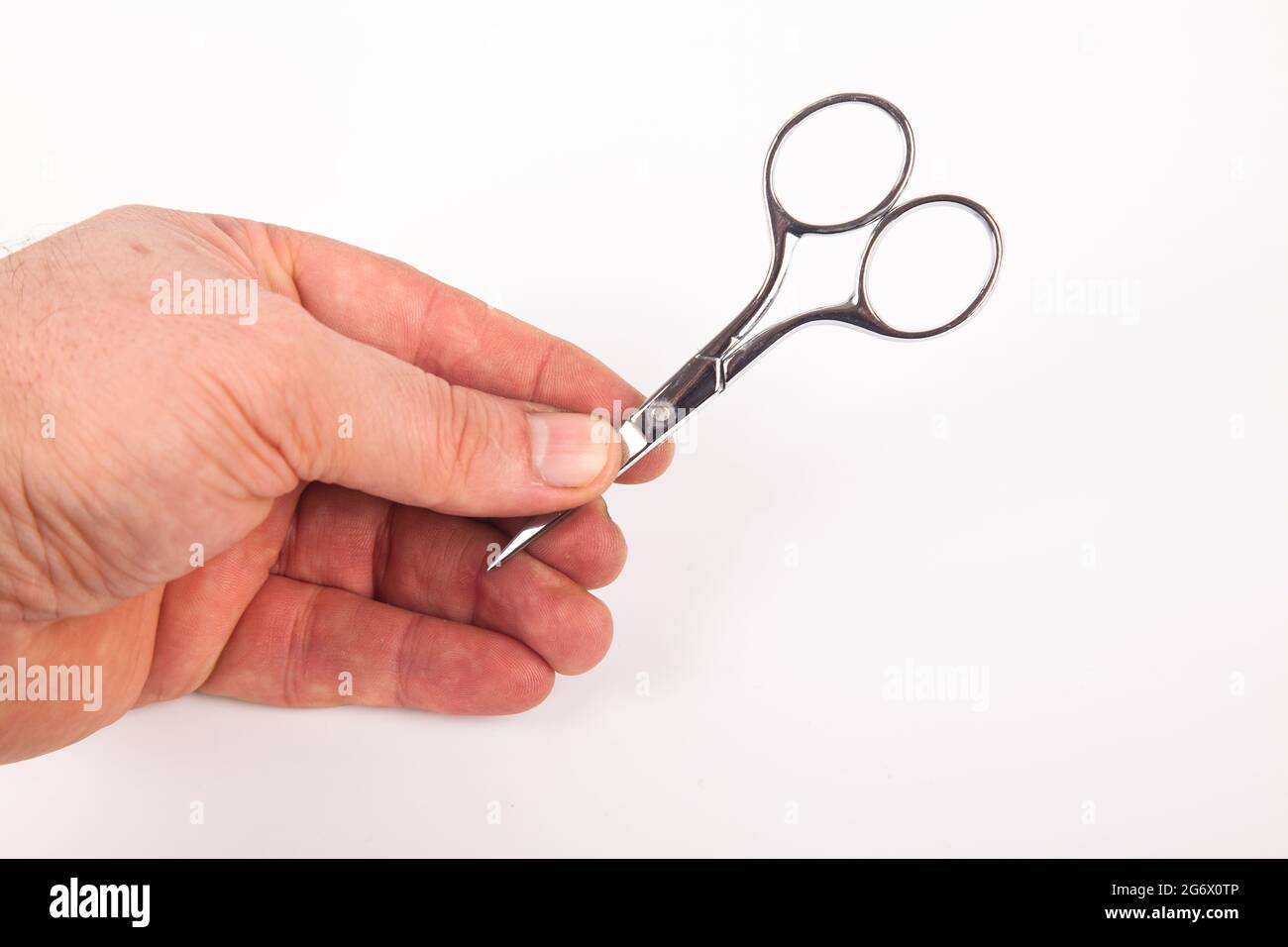 Very sharp retro professional small tailor scissors and hand, isolated ...