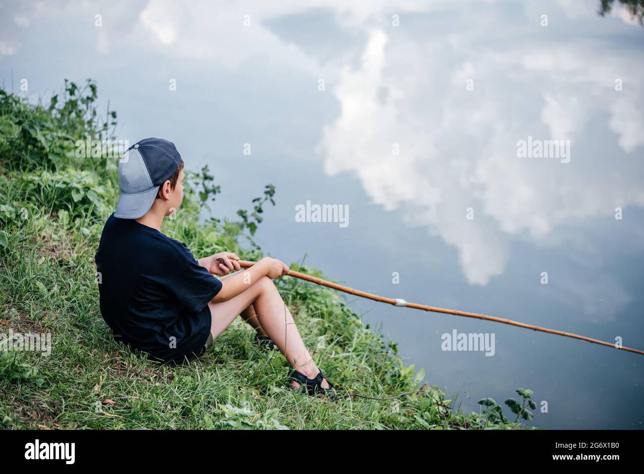 Children reel in fish lake hi-res stock photography and images - Alamy