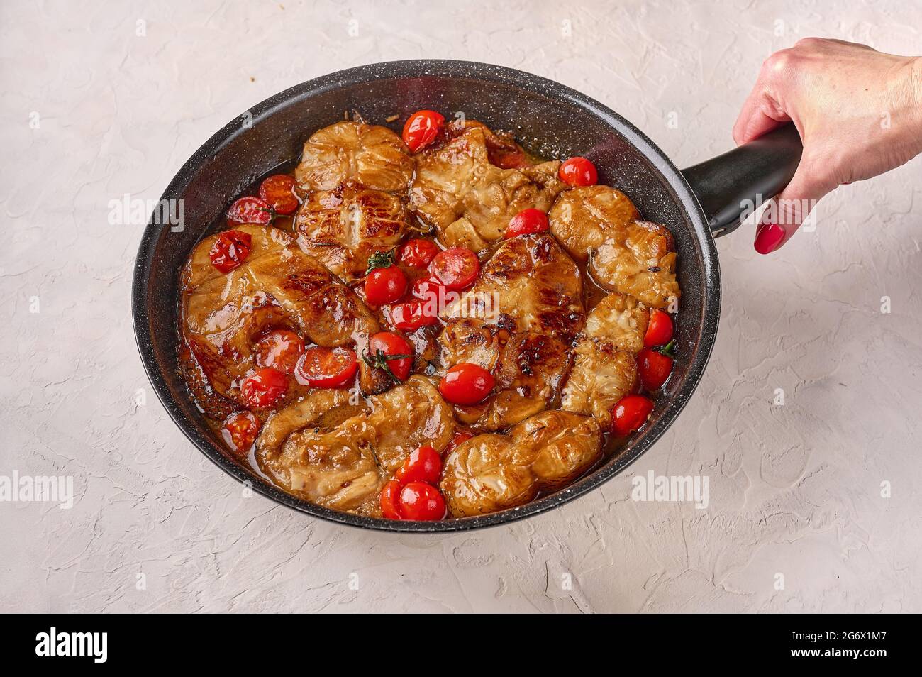 Woman frying fish hi-res stock photography and images - Alamy