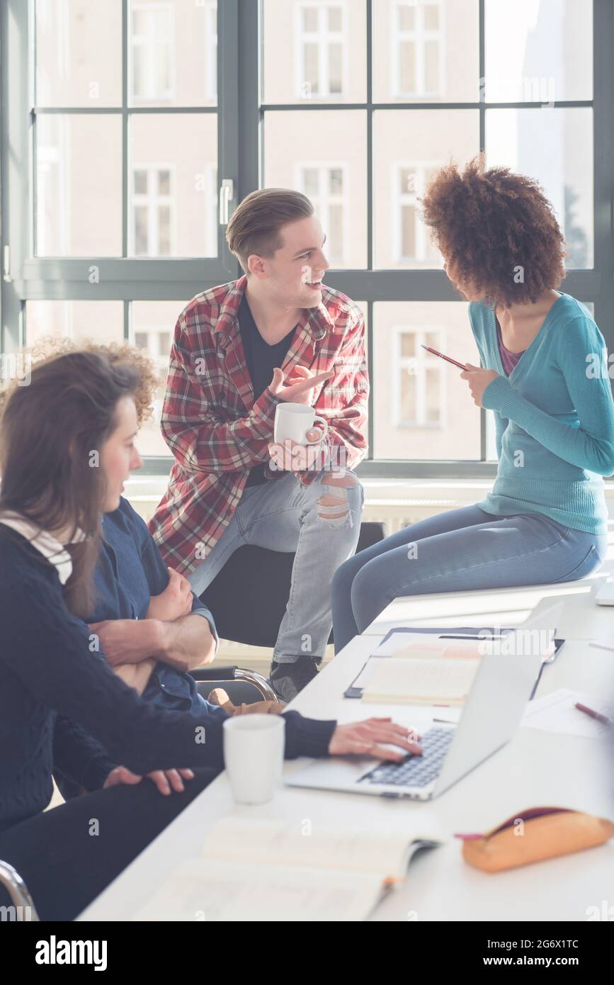 Group of women talking in a classroom hi-res stock photography and ...