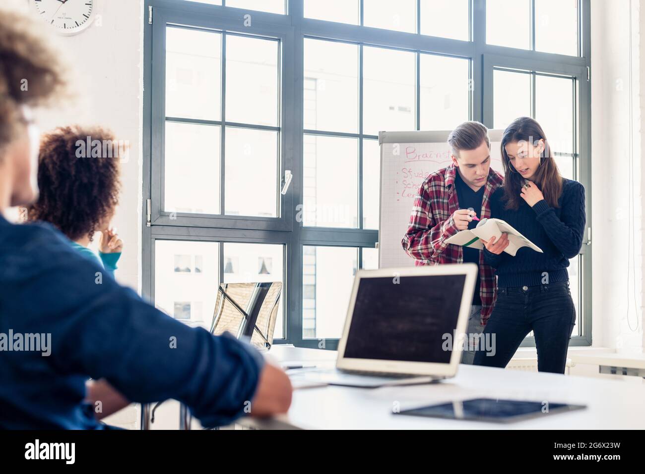 Involved students sharing ideas and opinions while brainstorming during ...