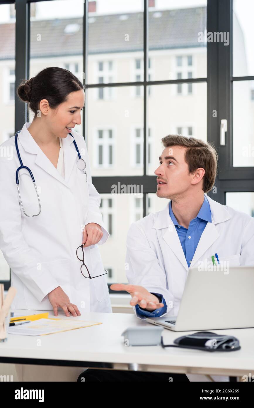 Asking experienced colleague hi-res stock photography and images - Alamy