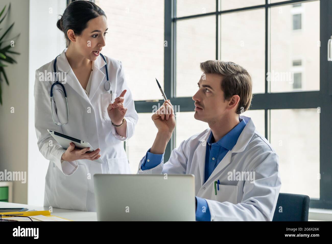 Asking experienced colleague hi-res stock photography and images - Alamy