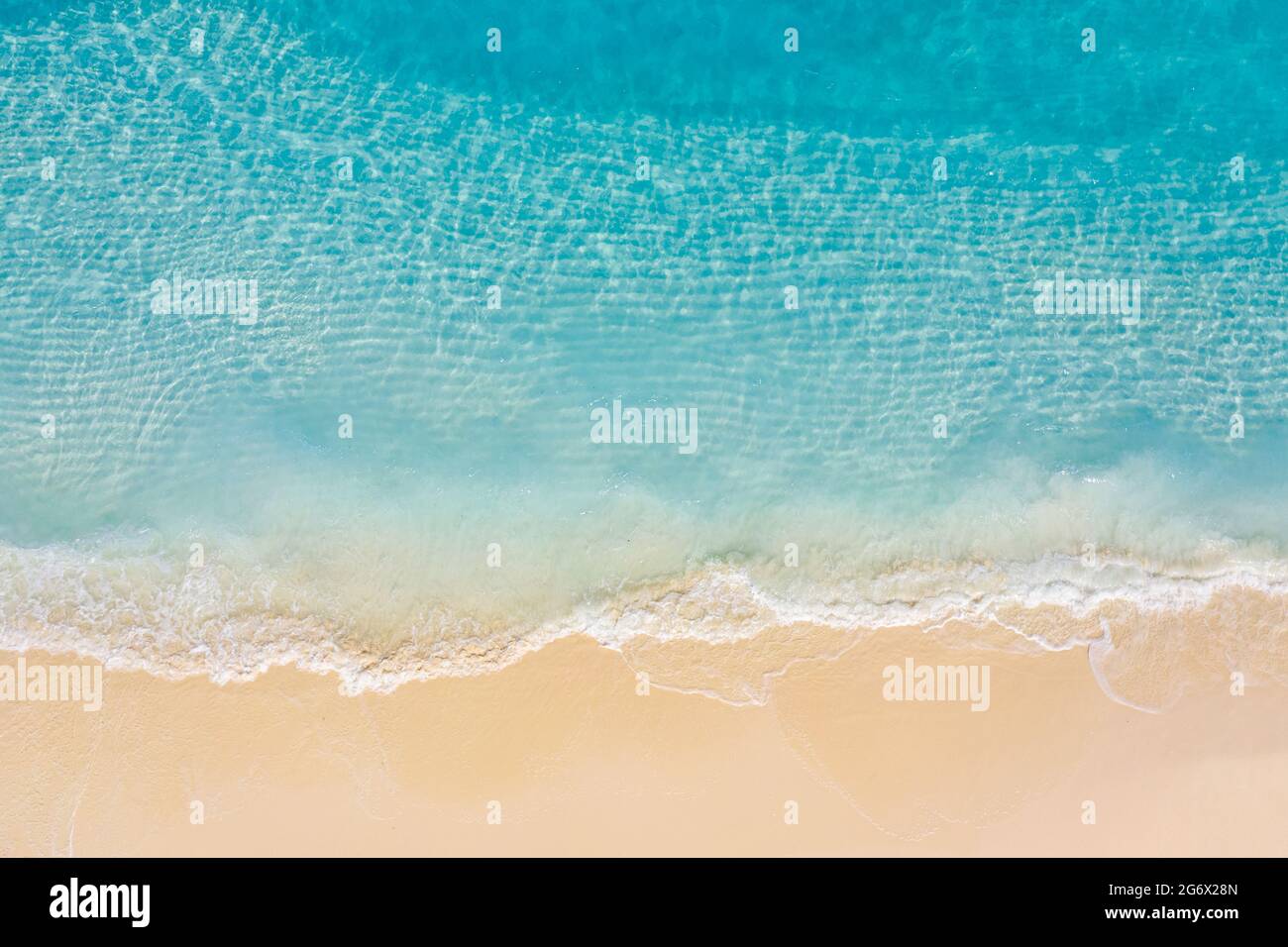 Aerial view of sandy beach and ocean with waves. Relaxing top view ...