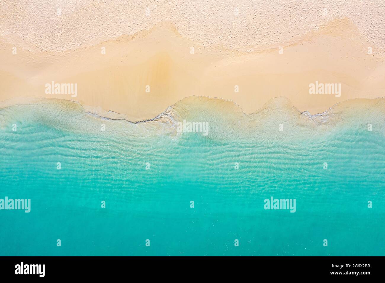 Aerial view of sandy beach and ocean with waves. Relaxing top view ...