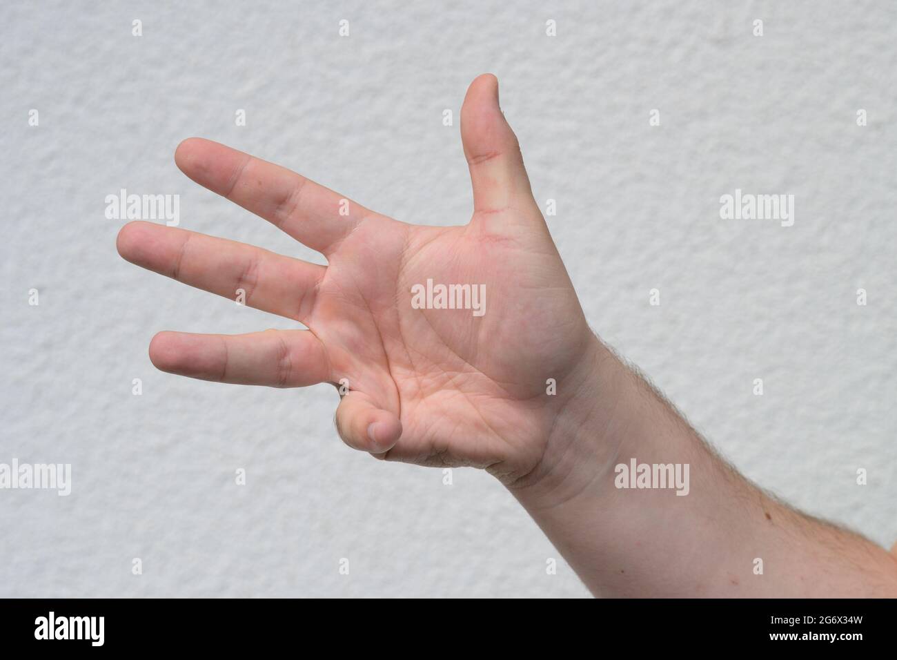 Male hand showing four fingers hi-res stock photography and images - Alamy