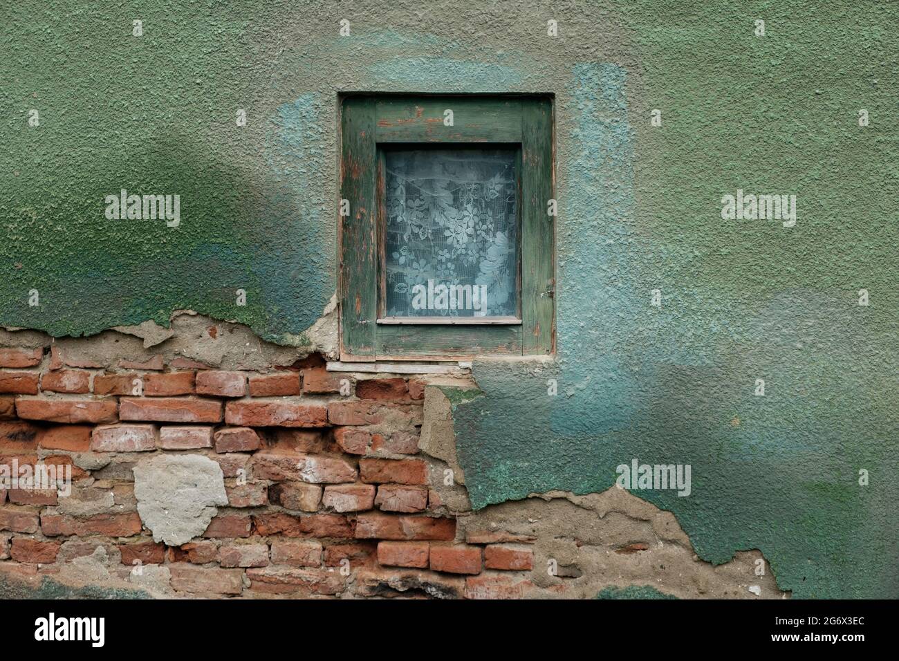 old green soaked brick wall wooden window Stock Photo - Alamy