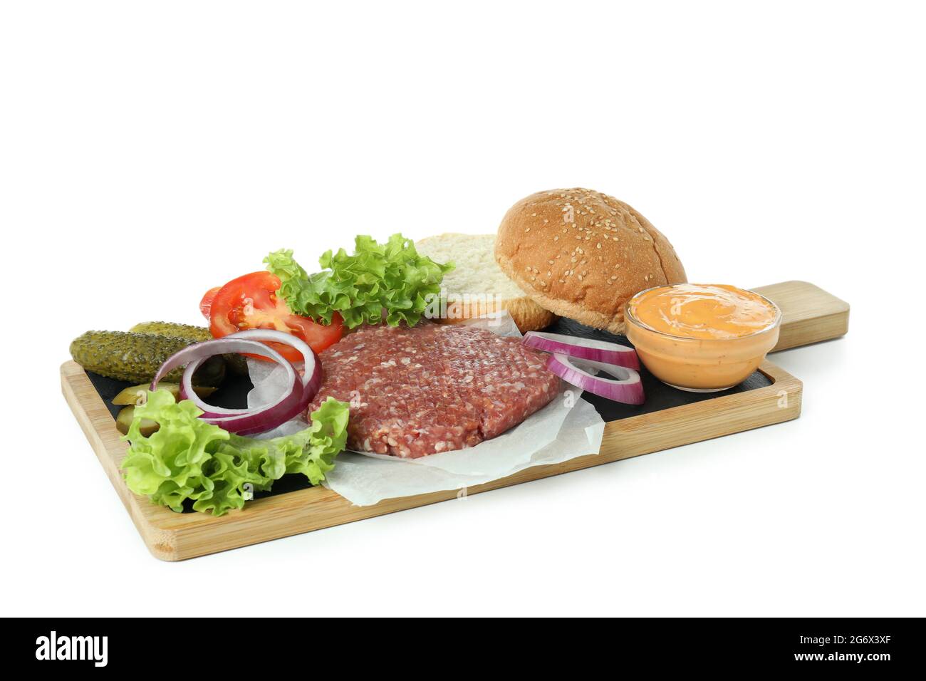 Concept of cooking burger isolated on white background Stock Photo - Alamy