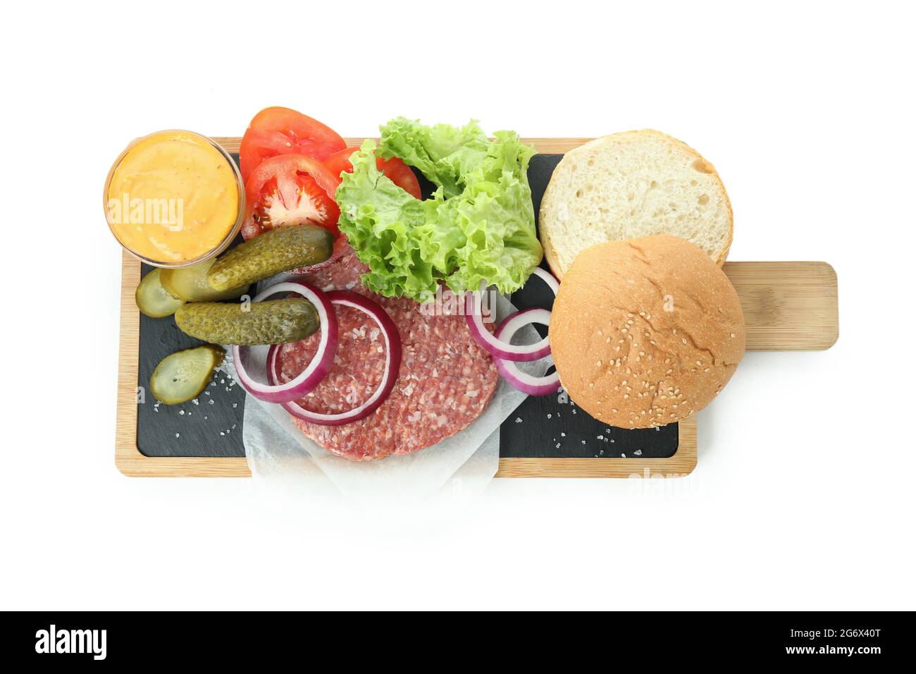 Concept of cooking burger isolated on white background Stock Photo - Alamy