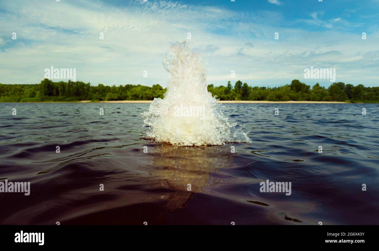 Explosion on the water in the river, in the distance you can see the ...