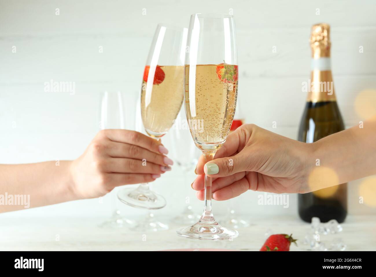 Female hands cheers with Rossini cocktails, close up Stock Photo - Alamy