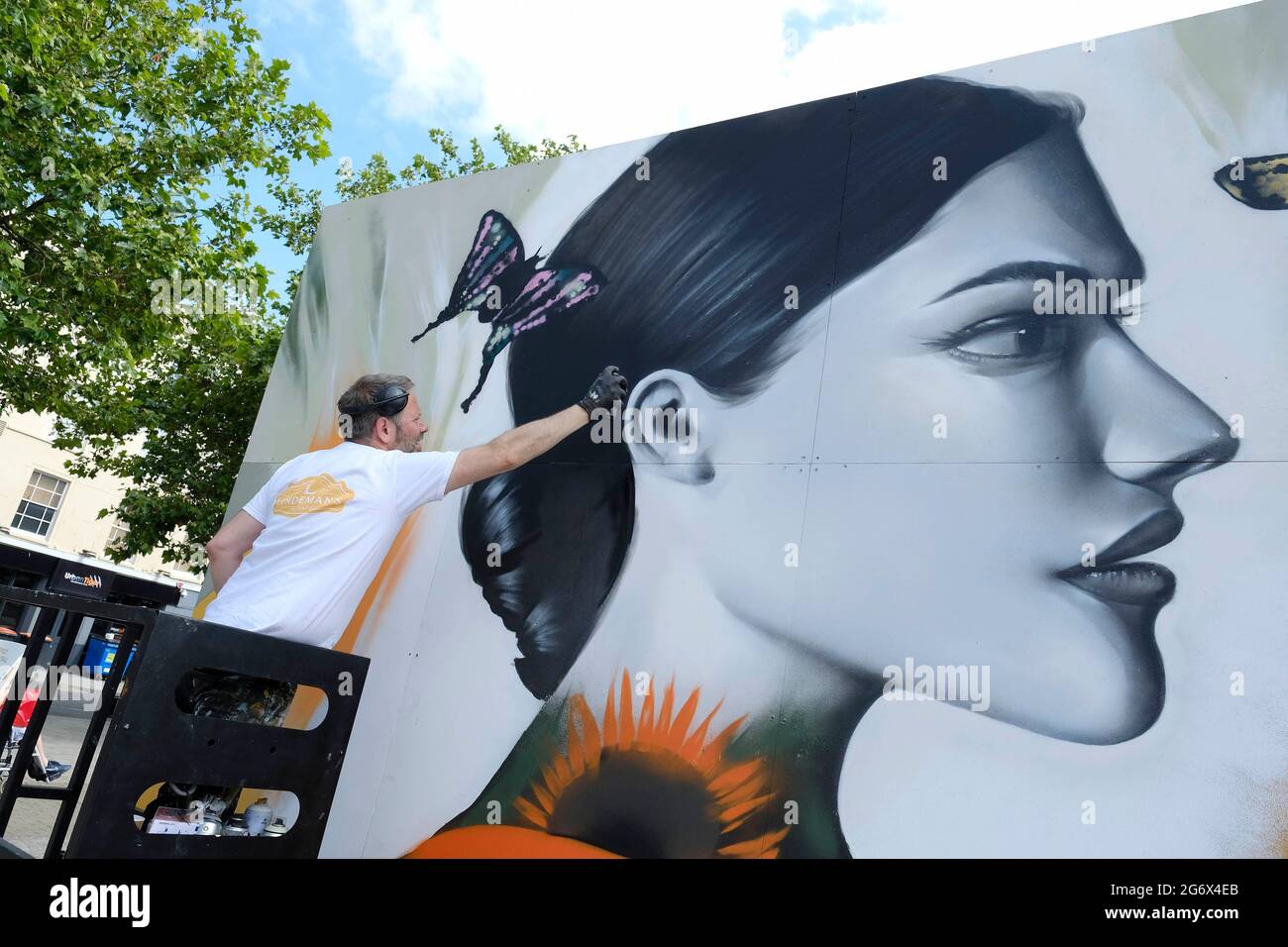 EDITORIAL USE ONLY Street artist, Jody Thomas puts the finishing ...