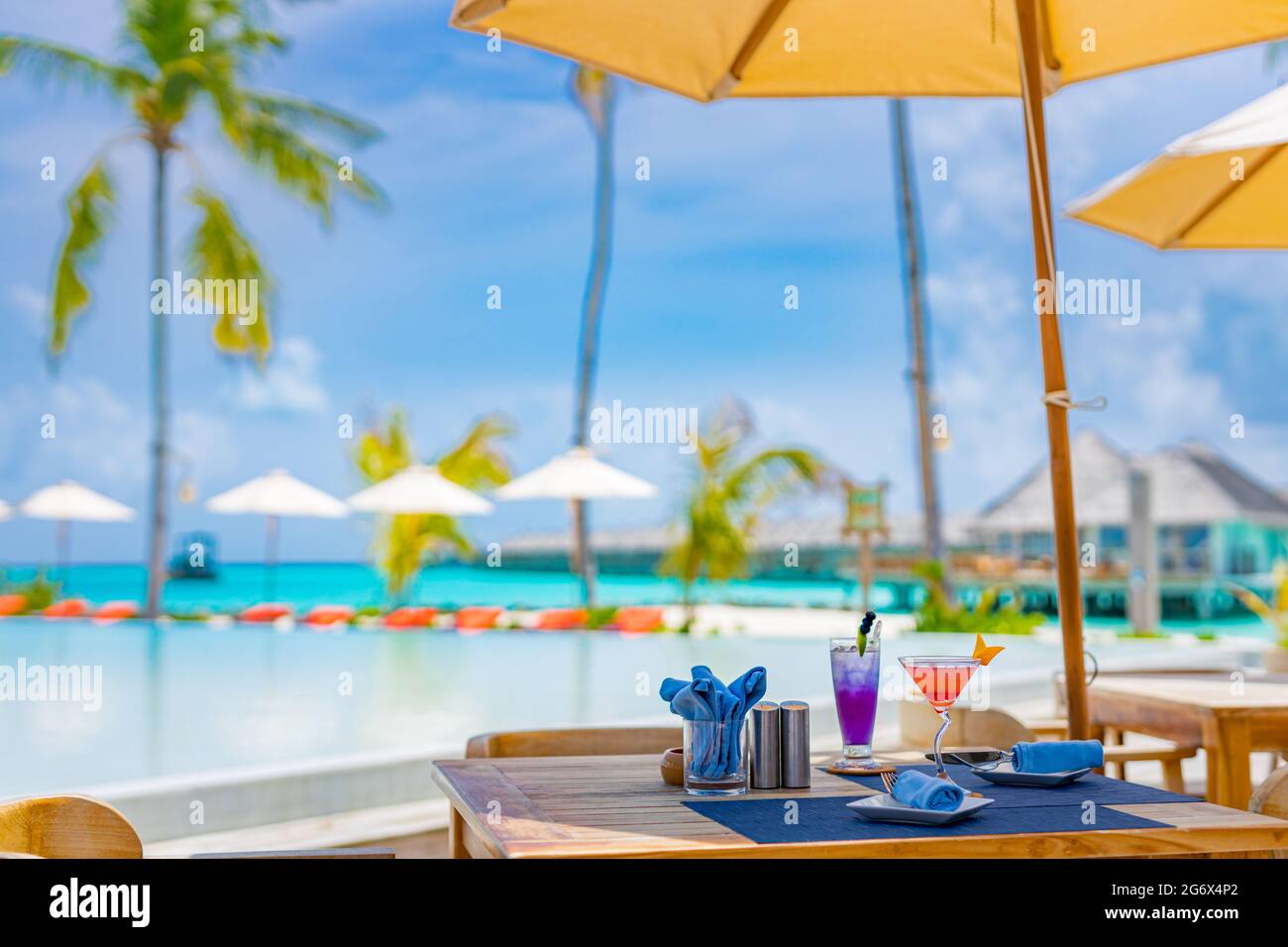 Luxury resort hotel poolside, outdoor restaurant on the beach, ocean ...