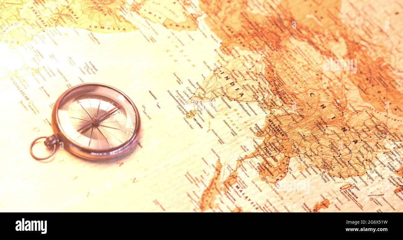 Image of compass and flickering map of asia in the background Stock ...