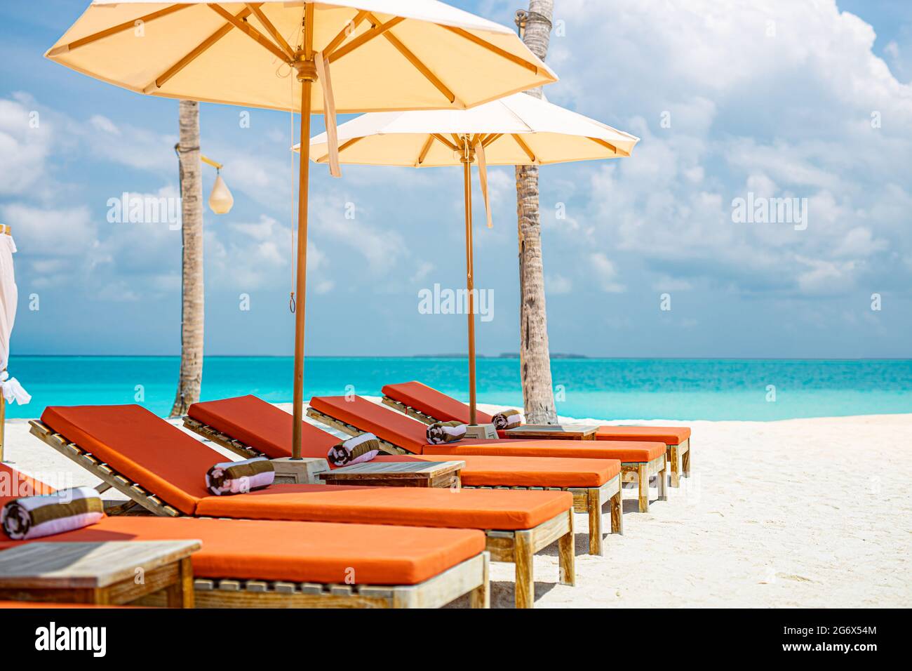 Beautiful tropical island scenery, two sun beds, loungers, umbrella ...
