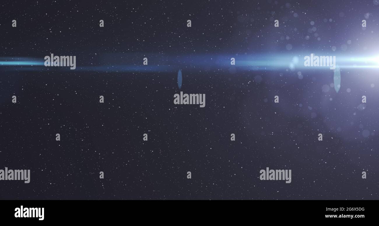 Blue spot of light glowing in the night sky Stock Photo - Alamy