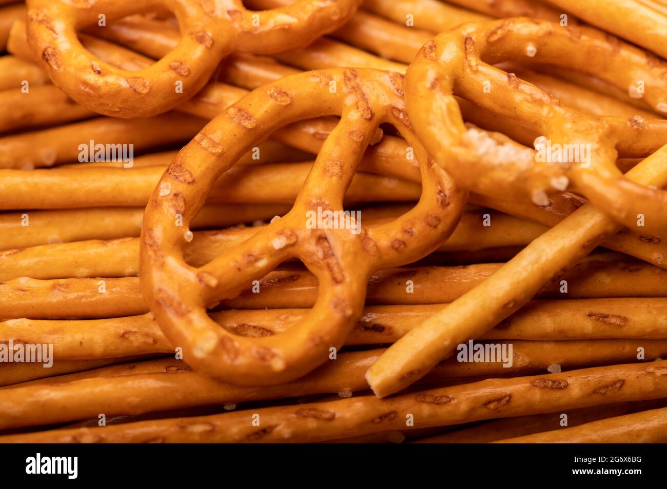 Bread sticks and bread figures with salt. Close-up Background image ...