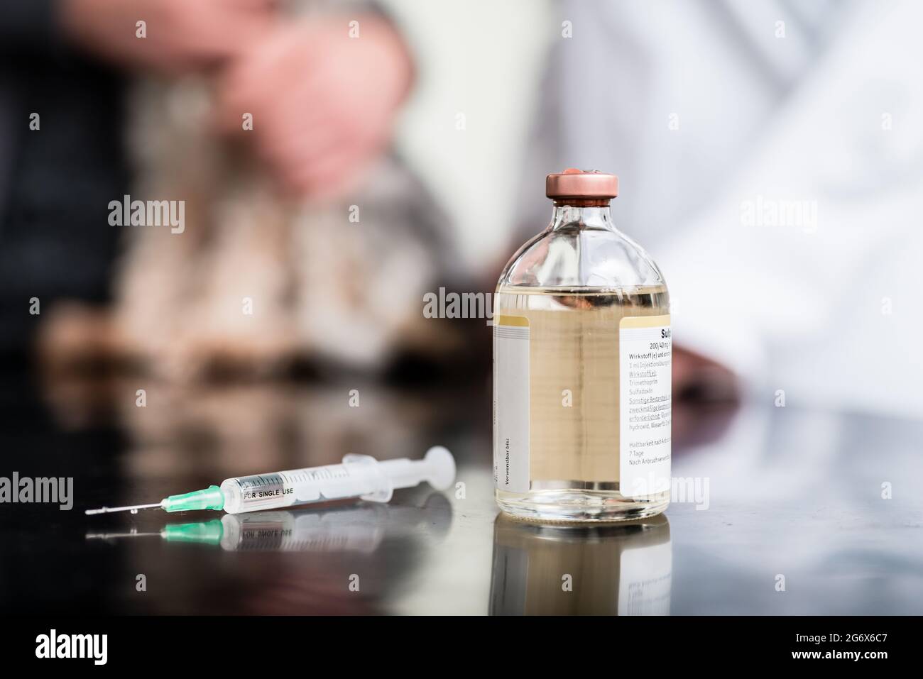Close-up of syringe and injection solution bottle Stock Photo - Alamy