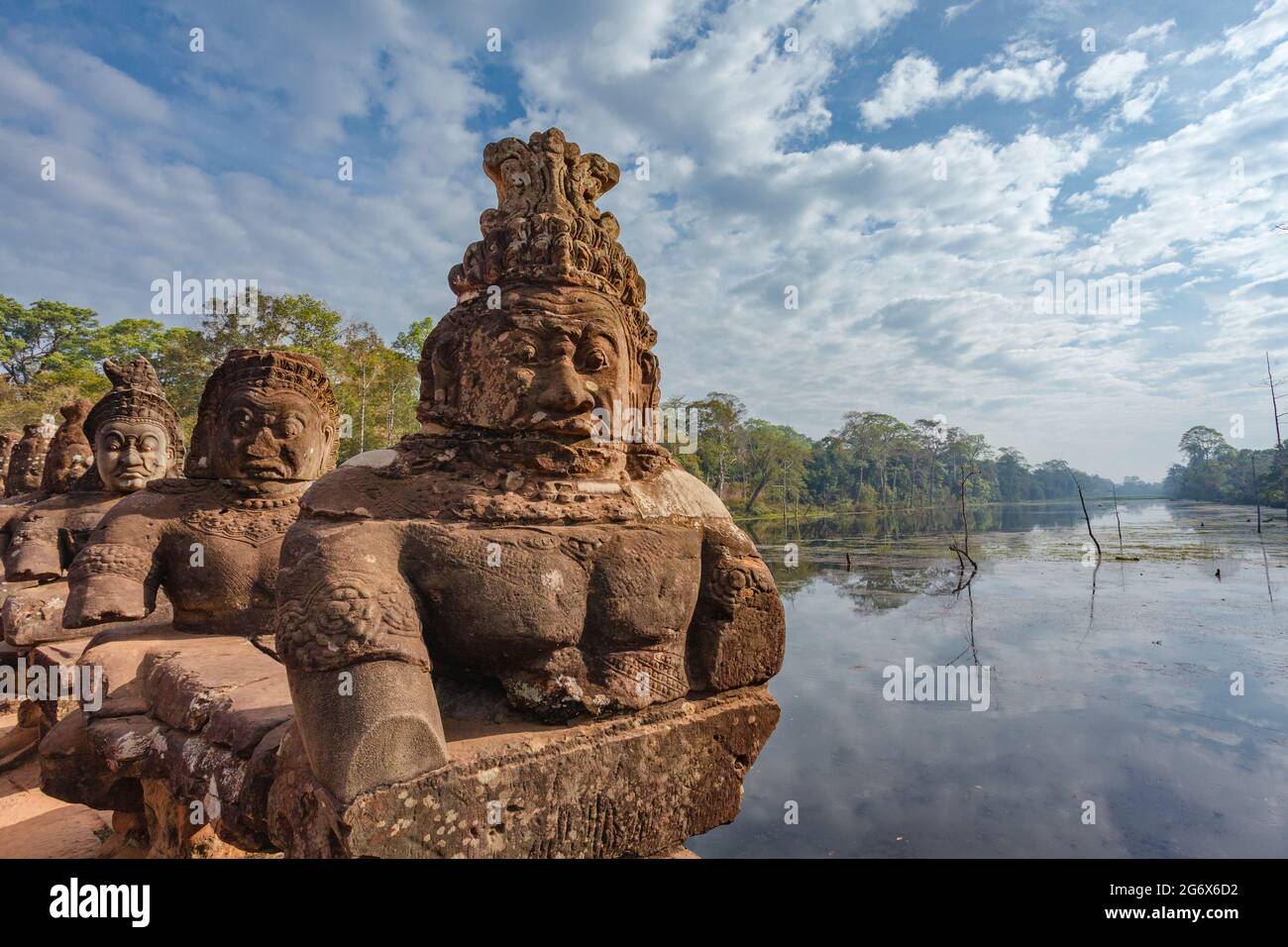 South gate of Angkor Thom along with a bridge of statues of gods and ...