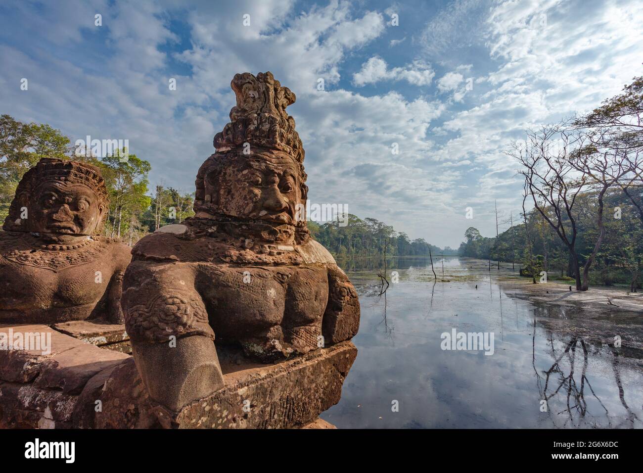 South gate of Angkor Thom along with a bridge of statues of gods and ...