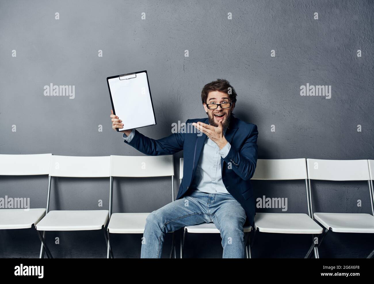 man applying for a job filling out resume waiting for job interview ...