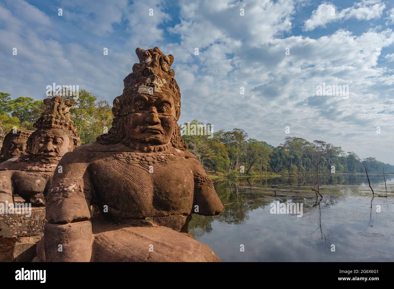 South gate of Angkor Thom along with a bridge of statues of gods and ...
